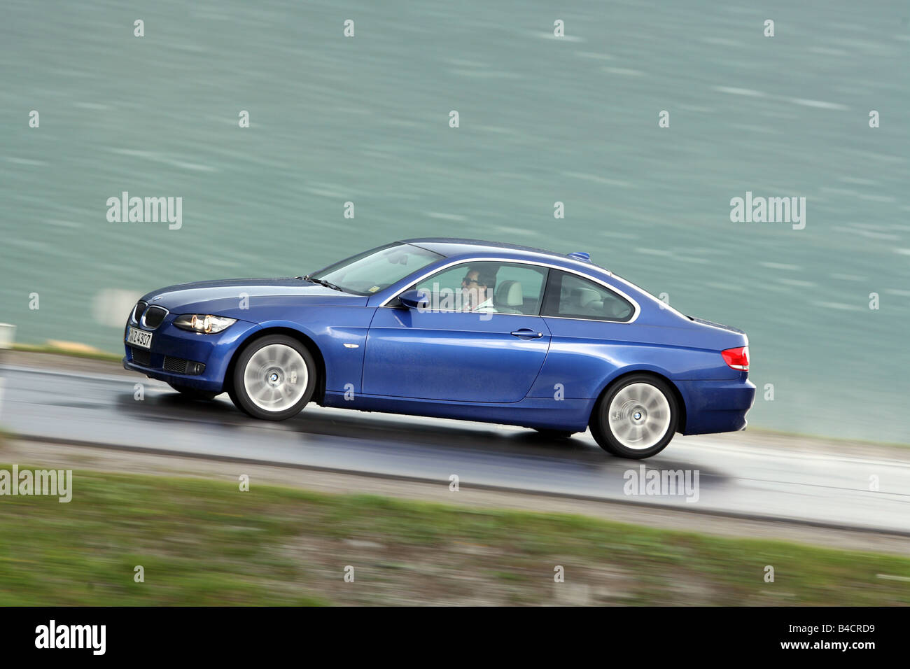BMW 335i Coupe, coupe, model year 2006-, blue moving, side view ...