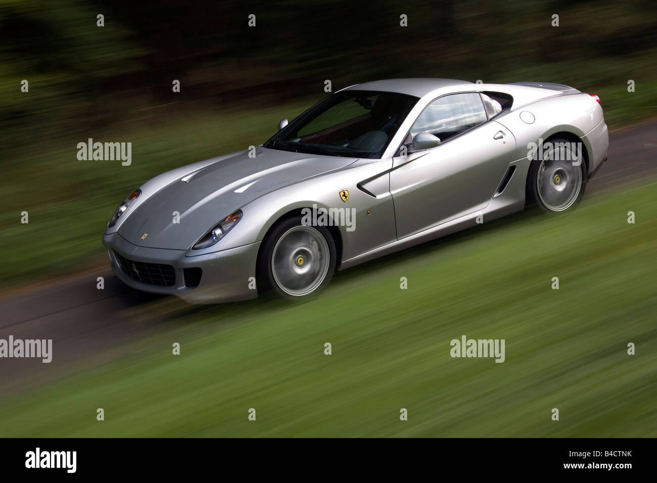 Ferrari 599 GTB Fiorano F1, model year 2006-, silver, driving, diagonal ...