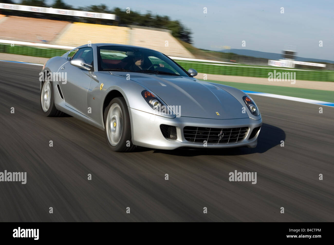 Ferrari 599 GTB Fiorano F1, model year 2006-, silver, driving, diagonal ...