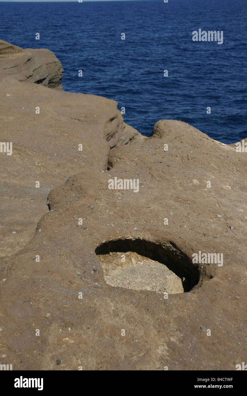 pattern on eroded volcanic rock formation on coast at venotene, italy ...