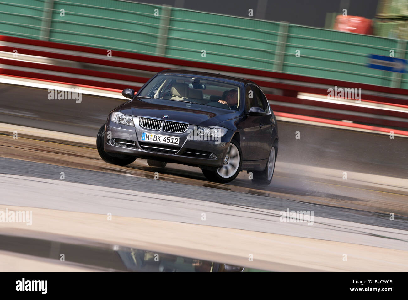 BMW 335d, model year 2006-, black, driving, diagonal from the front ...