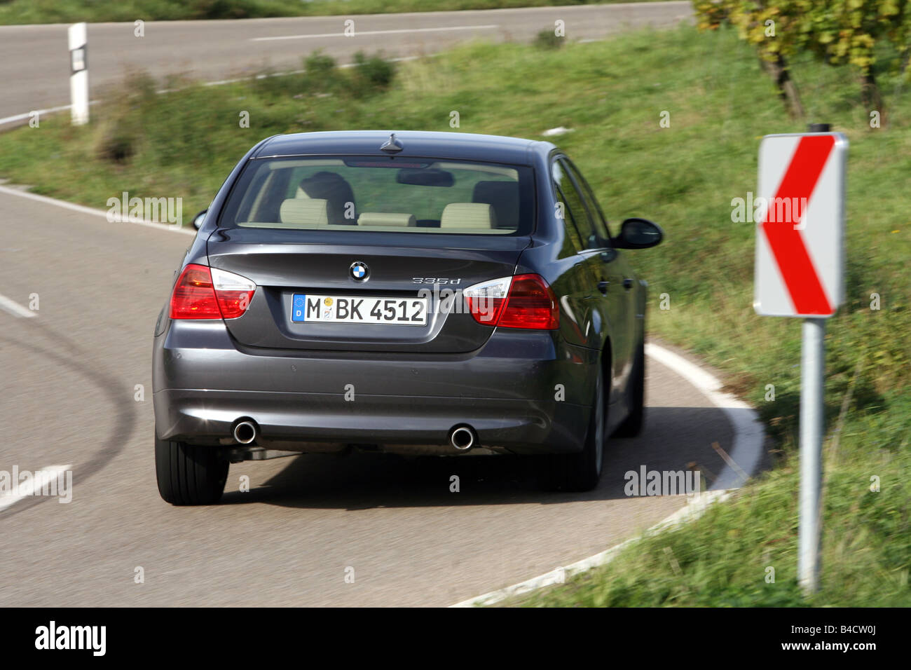 BMW 335d, model year 2006-, black, driving, diagonal from the front ...