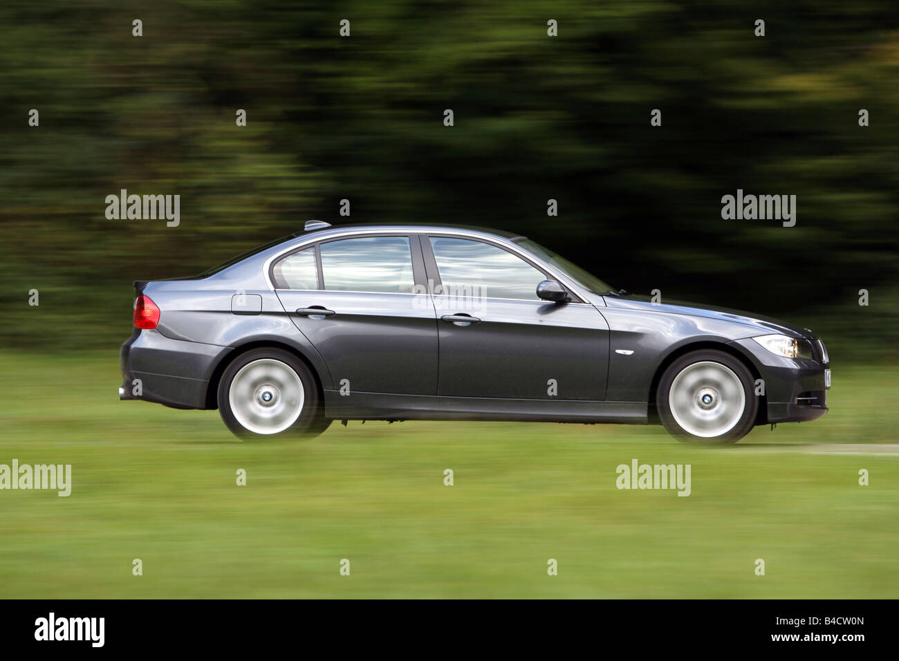 BMW 335d, model year 2006-, black, driving, diagonal from the front ...