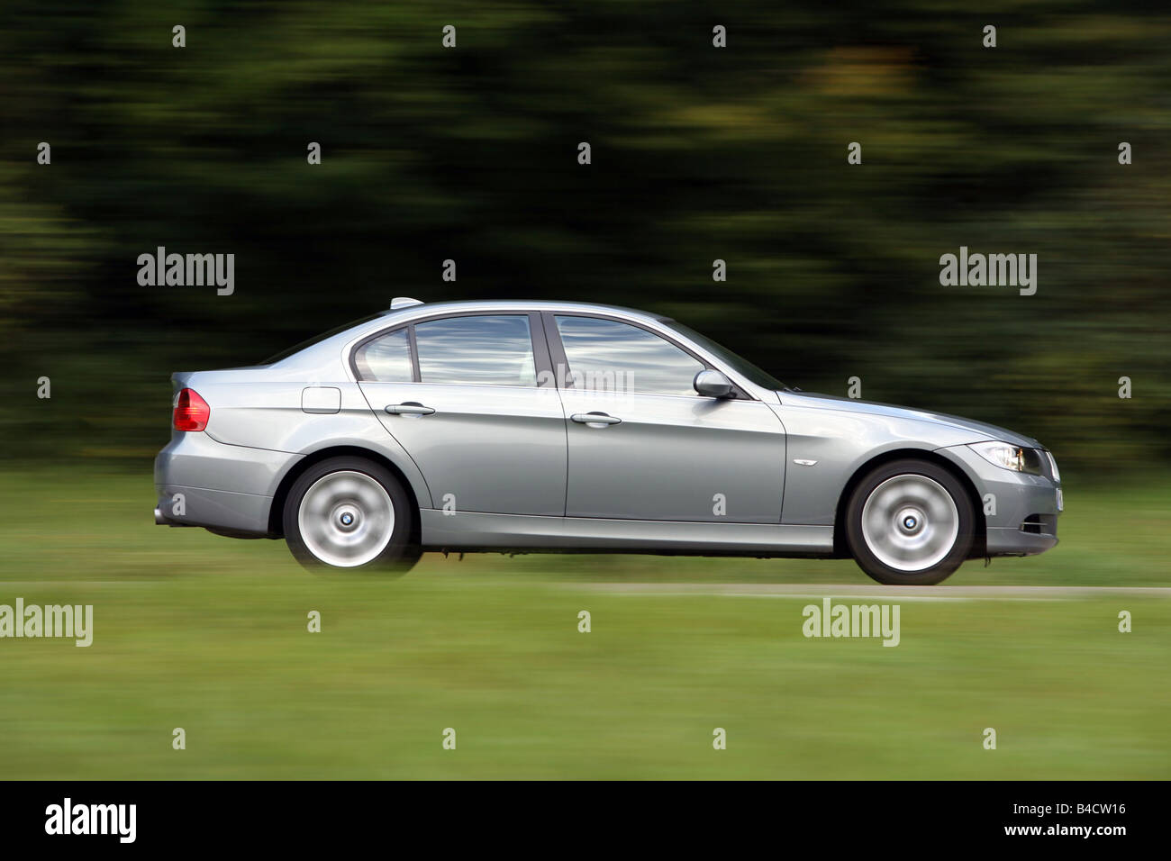 BMW 335i, model year 2006-, silver, driving, diagonal from the back ...