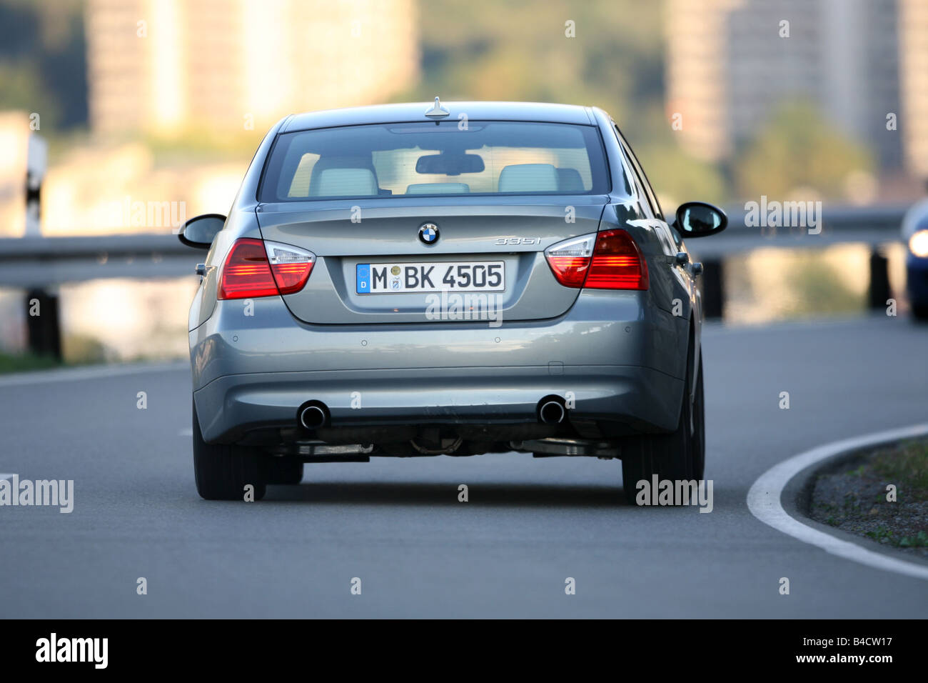 BMW 335i, model year 2006-, silver, driving, diagonal from the back ...