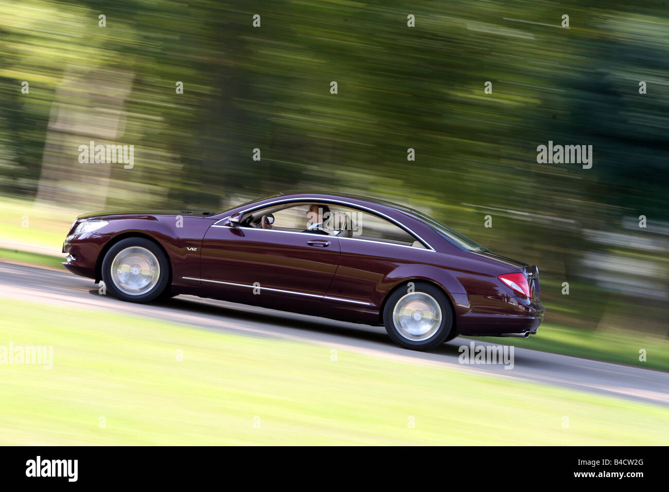 Mercedes CL 600, model year 2006-, ruby colored, driving, side view ...