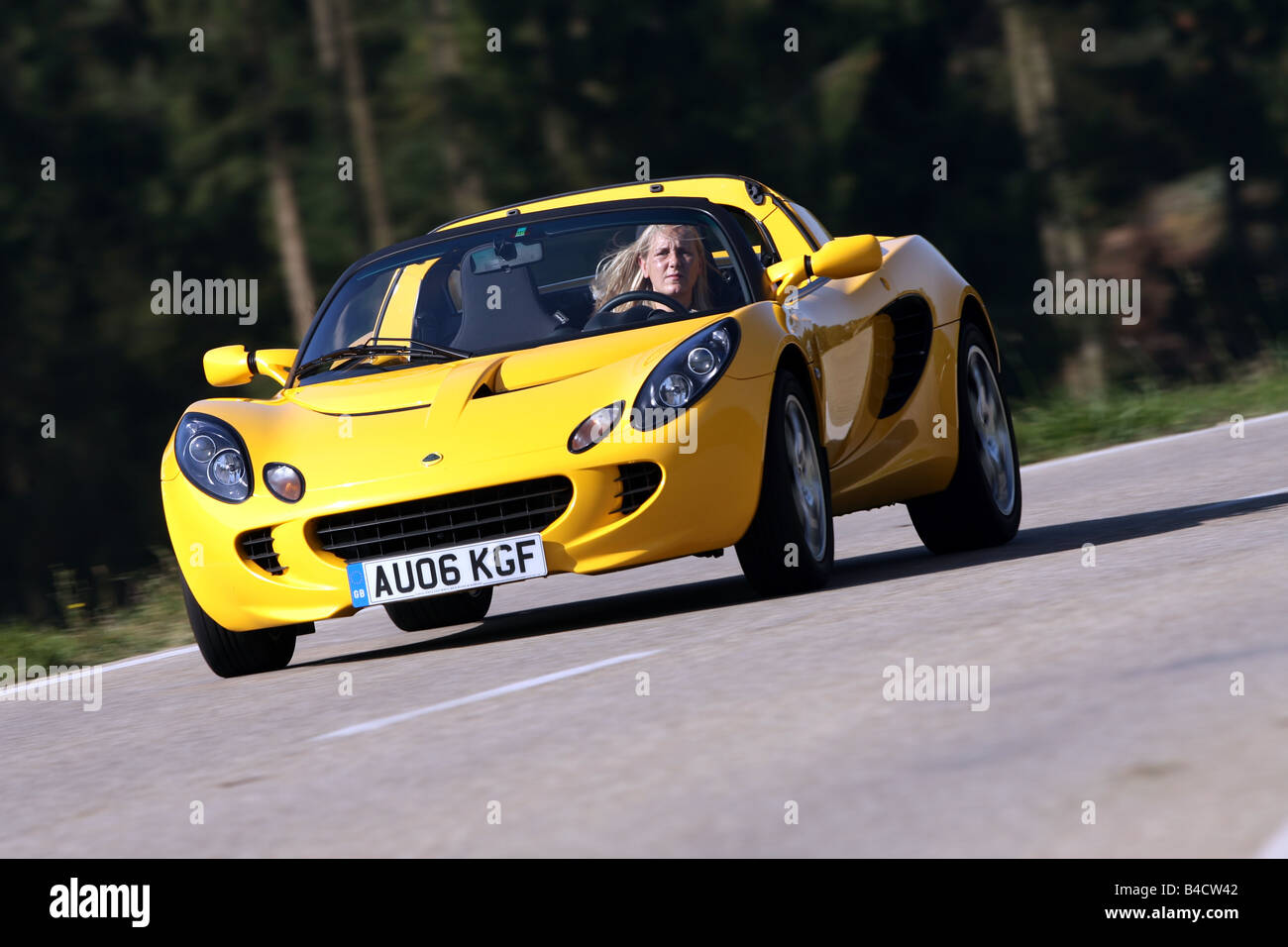 Lotus Elise S, model year 2006-, yellow, driving, diagonal from the ...