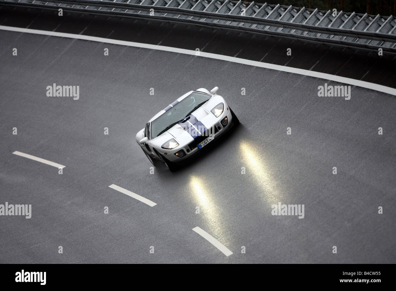 Ford GT, model year 2005-, white-blue moving, diagonal from the front ...