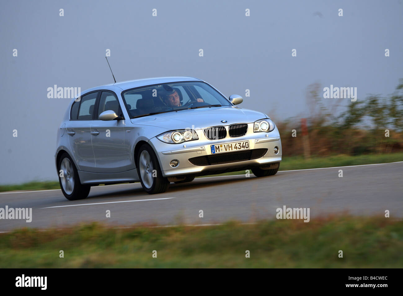 BMW 130i, model year 2005-, silver, driving, diagonal from the front, frontal view, country road ...