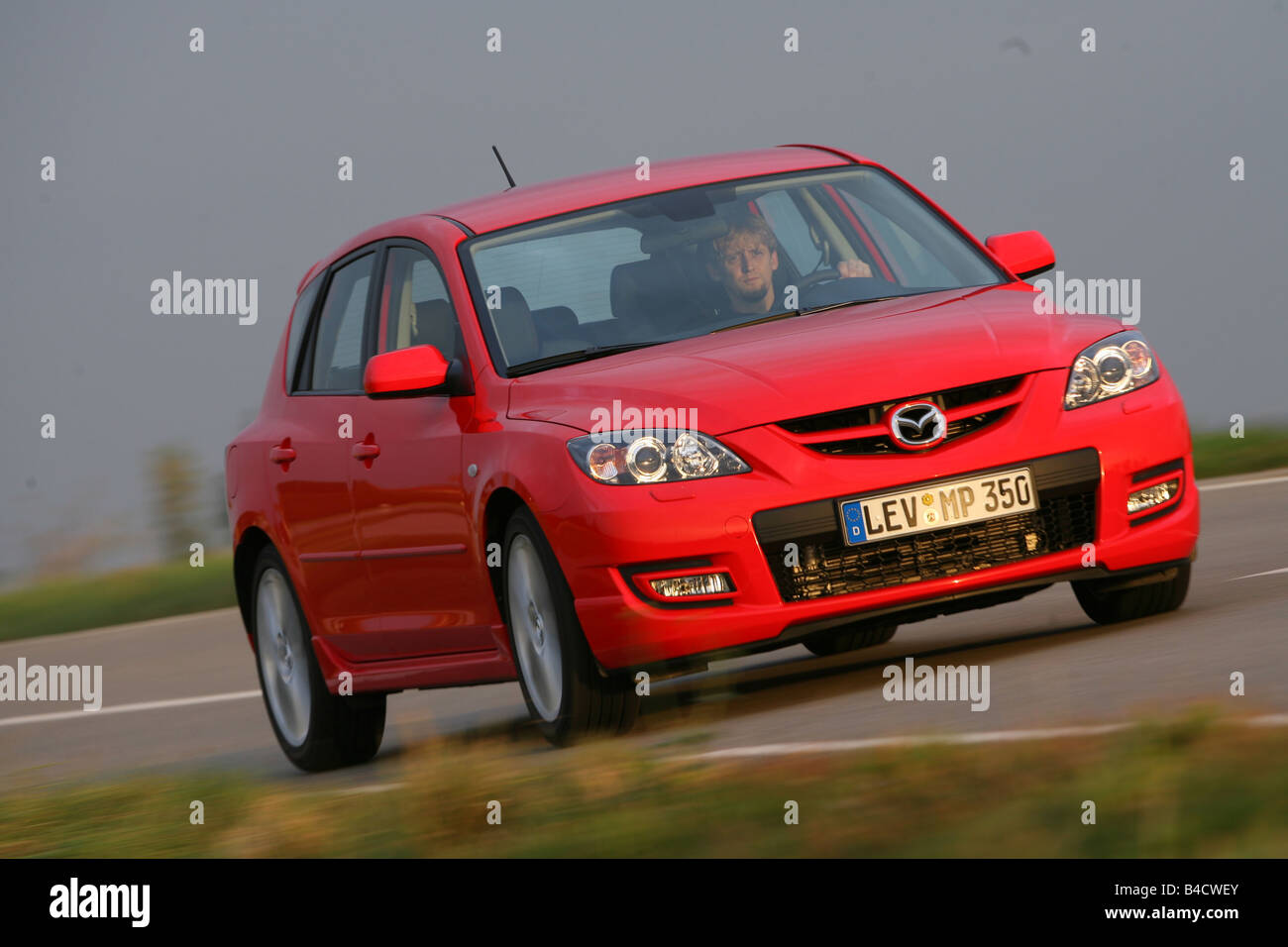 Mazda 3 MPS, model year 2006-, red, driving, diagonal from the front ...