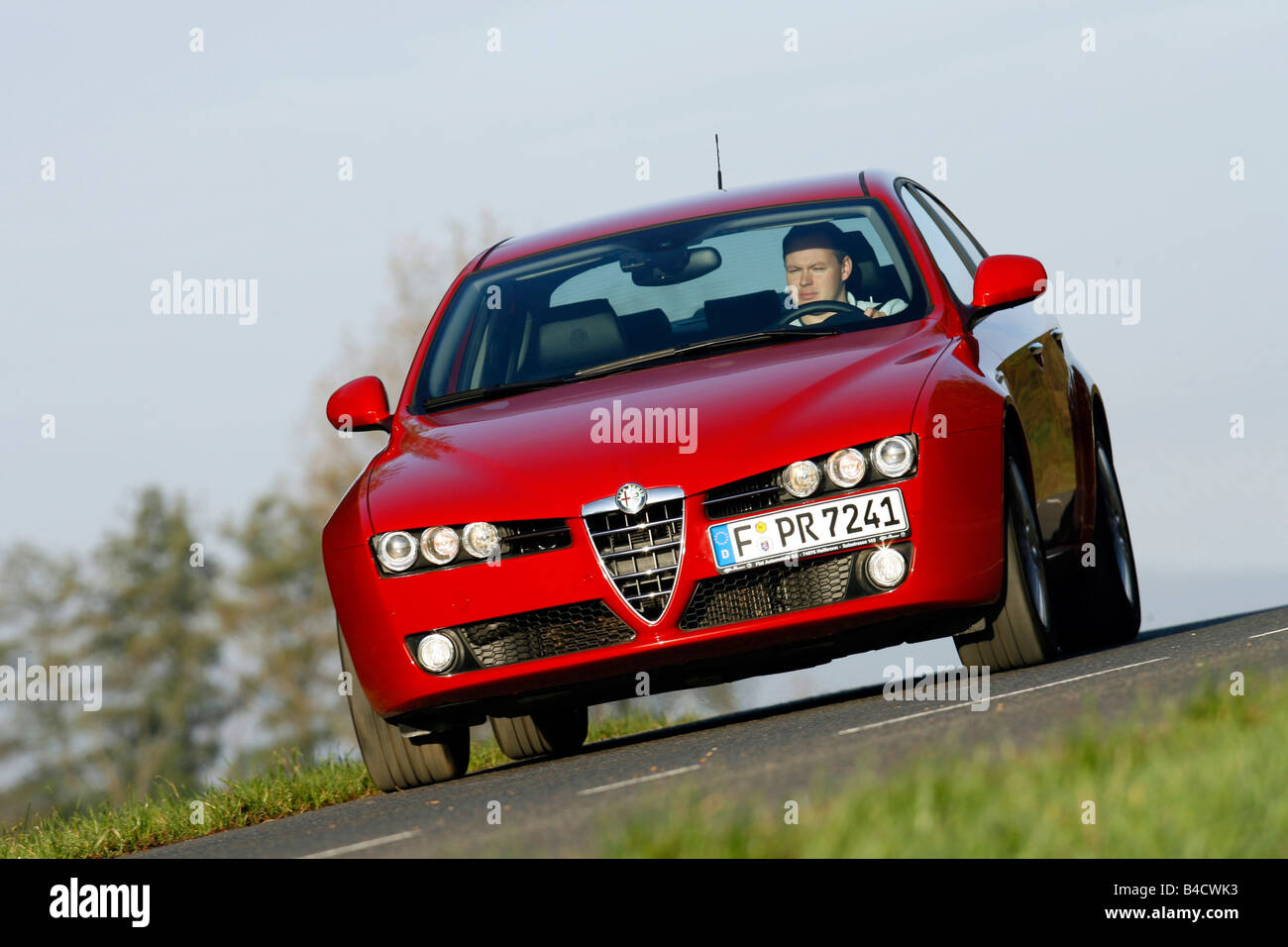 Alfa Romeo 159 2.4 JTDM, model year 2005-, red, driving, diagonal from ...