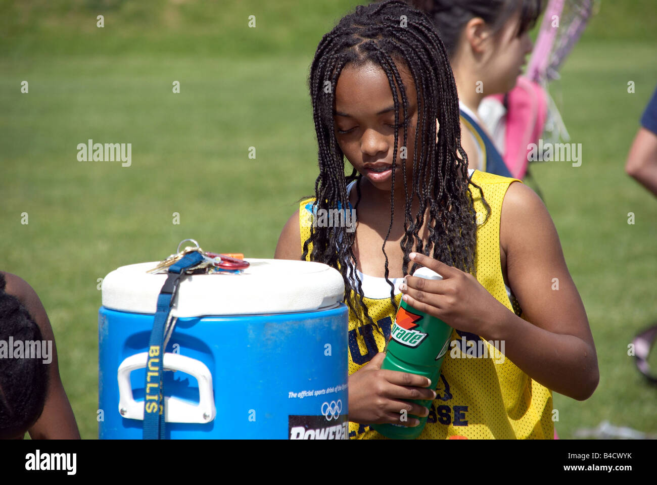 young girl getting Gatorade during a hot day Stock Photo - Alamy