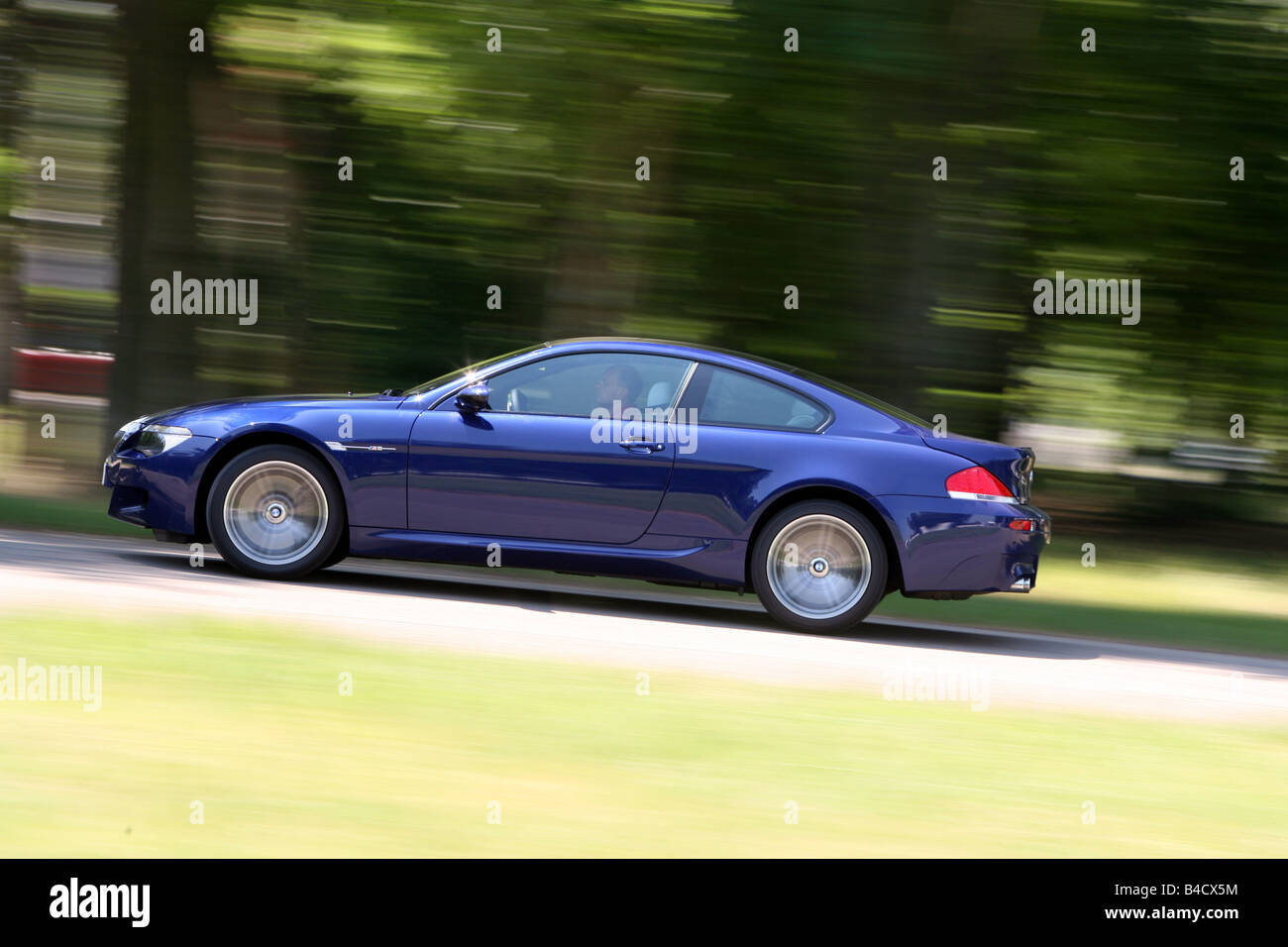 BMW M6, model year 2005-, blue moving, side view, country road Stock ...