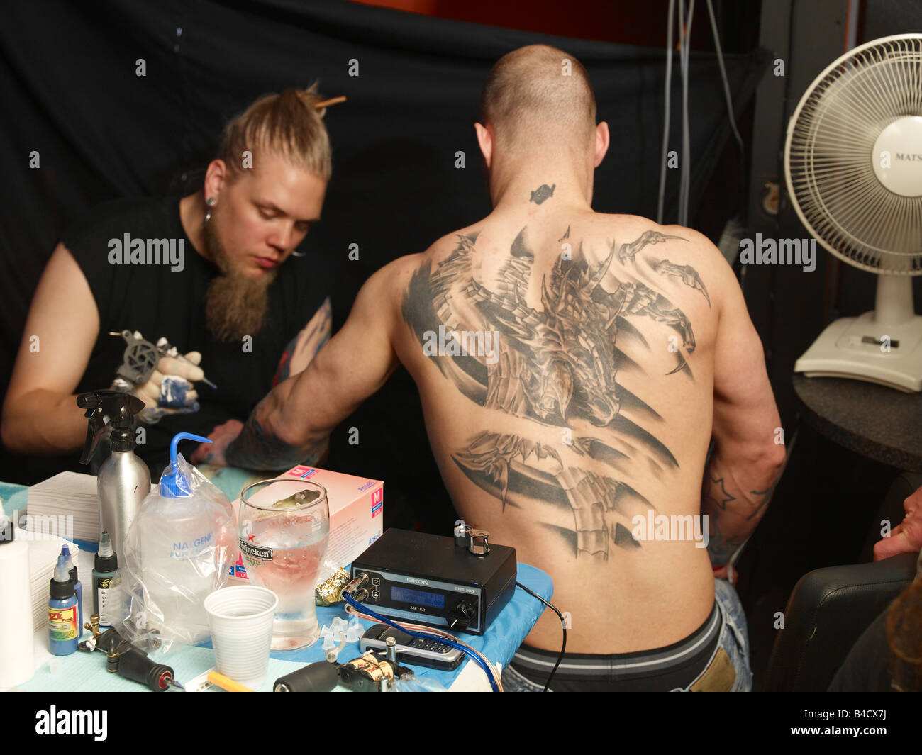 Tattoo Artist Creating New Tattoo Stock Photo - Alamy