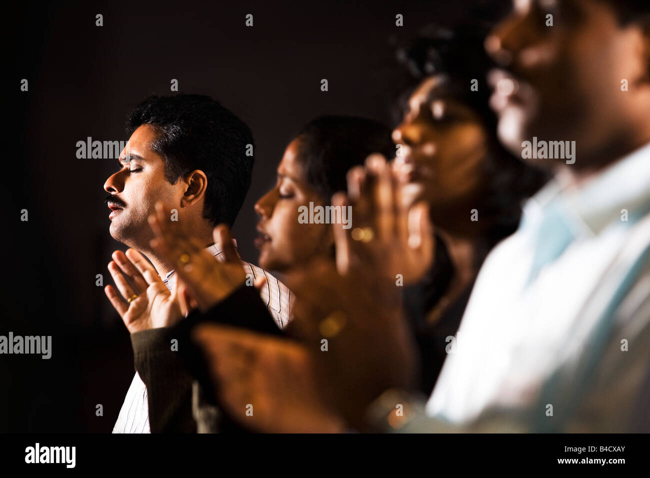 Christian group praying hi-res stock photography and images - Alamy