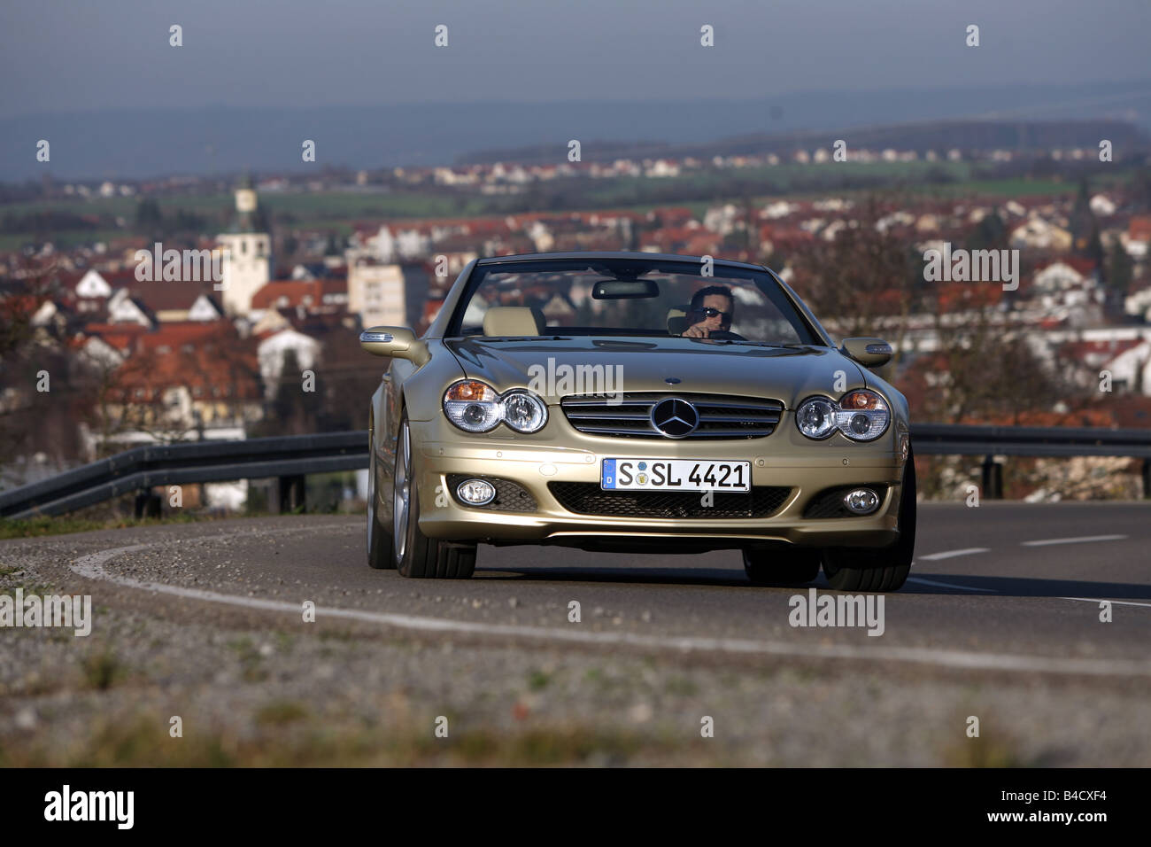 Mercedes SL 500, model year 2005-, gold, driving, diagonal from the ...
