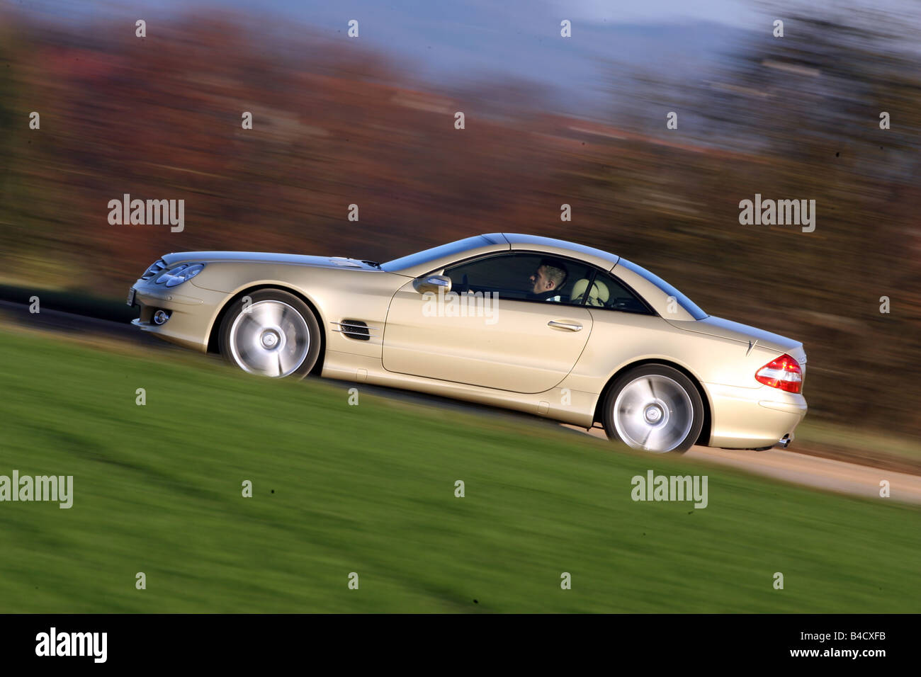 Mercedes SL 500, model year 2005-, gold, driving, side view, country ...