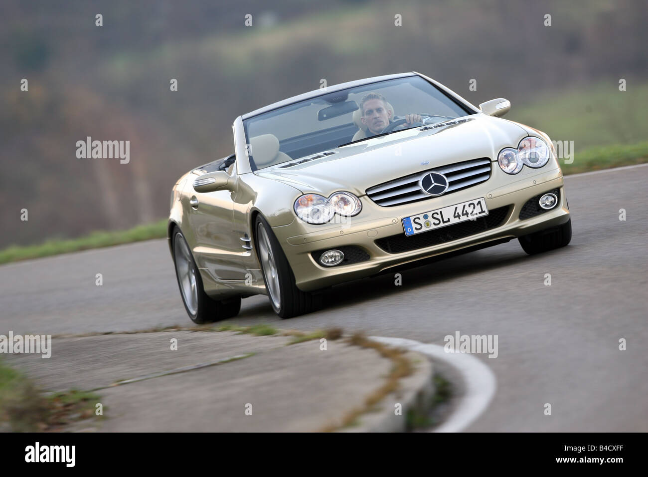 Mercedes SL 500, model year 2005-, gold, driving, diagonal from the ...