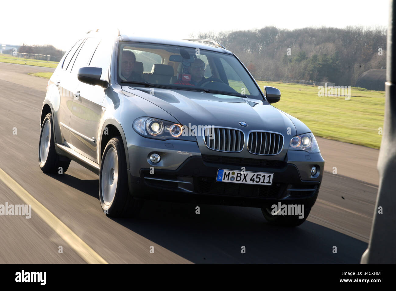 BMW X5 4.8i, model year 2006-, silver, driving, diagonal from the front ...