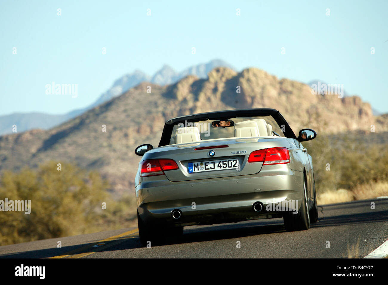 BMW 335i Convertible, model year 2007-, driving, diagonal from the back ...