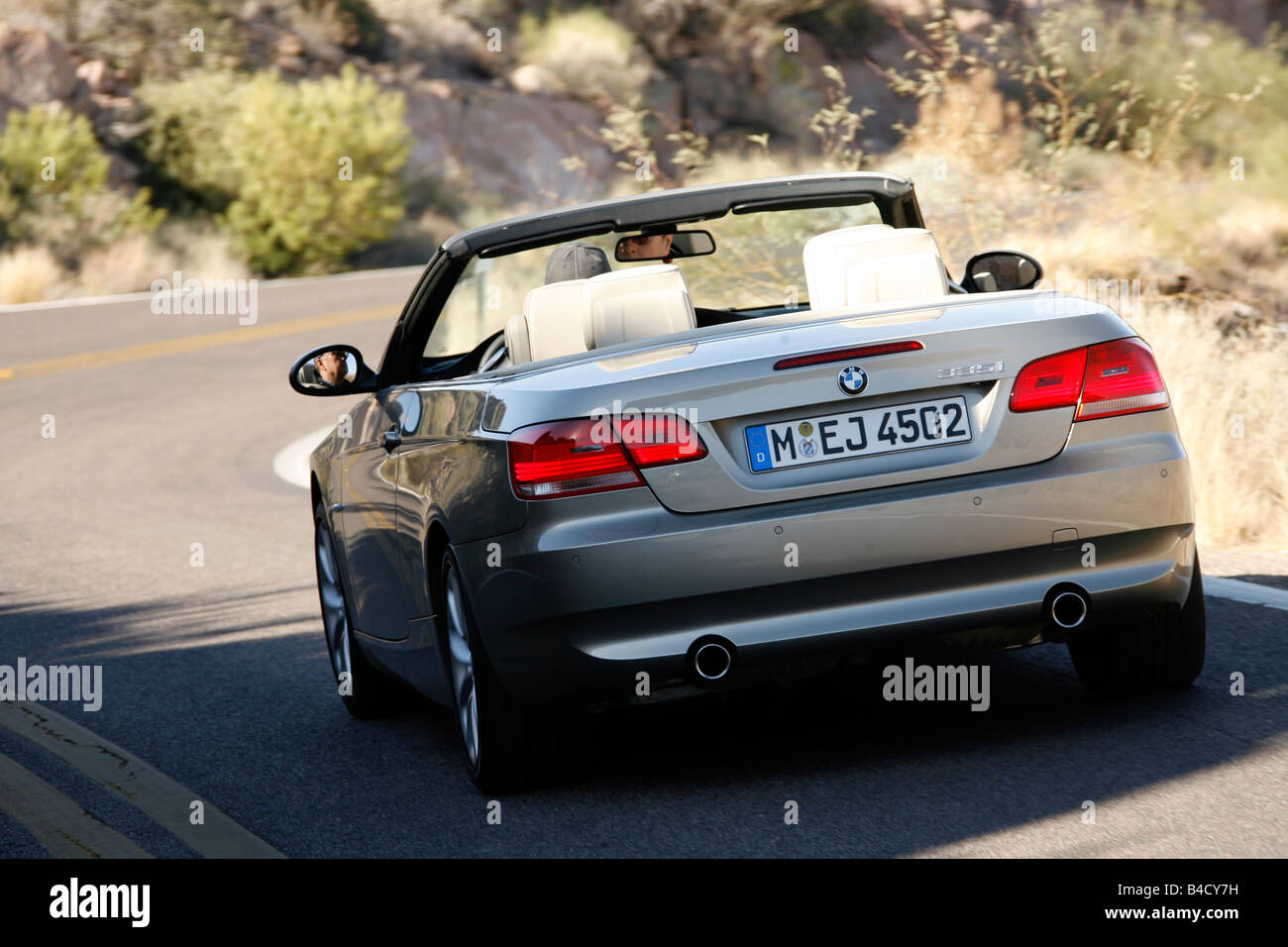 BMW 335i Convertible, model year 2007-, driving, diagonal from the back ...