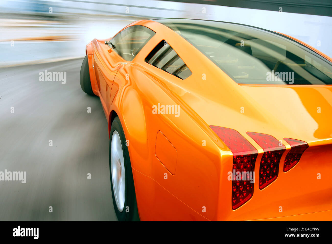 Ford Mustang by Giugiaro, model year 2007, orange -metallic, driving ...