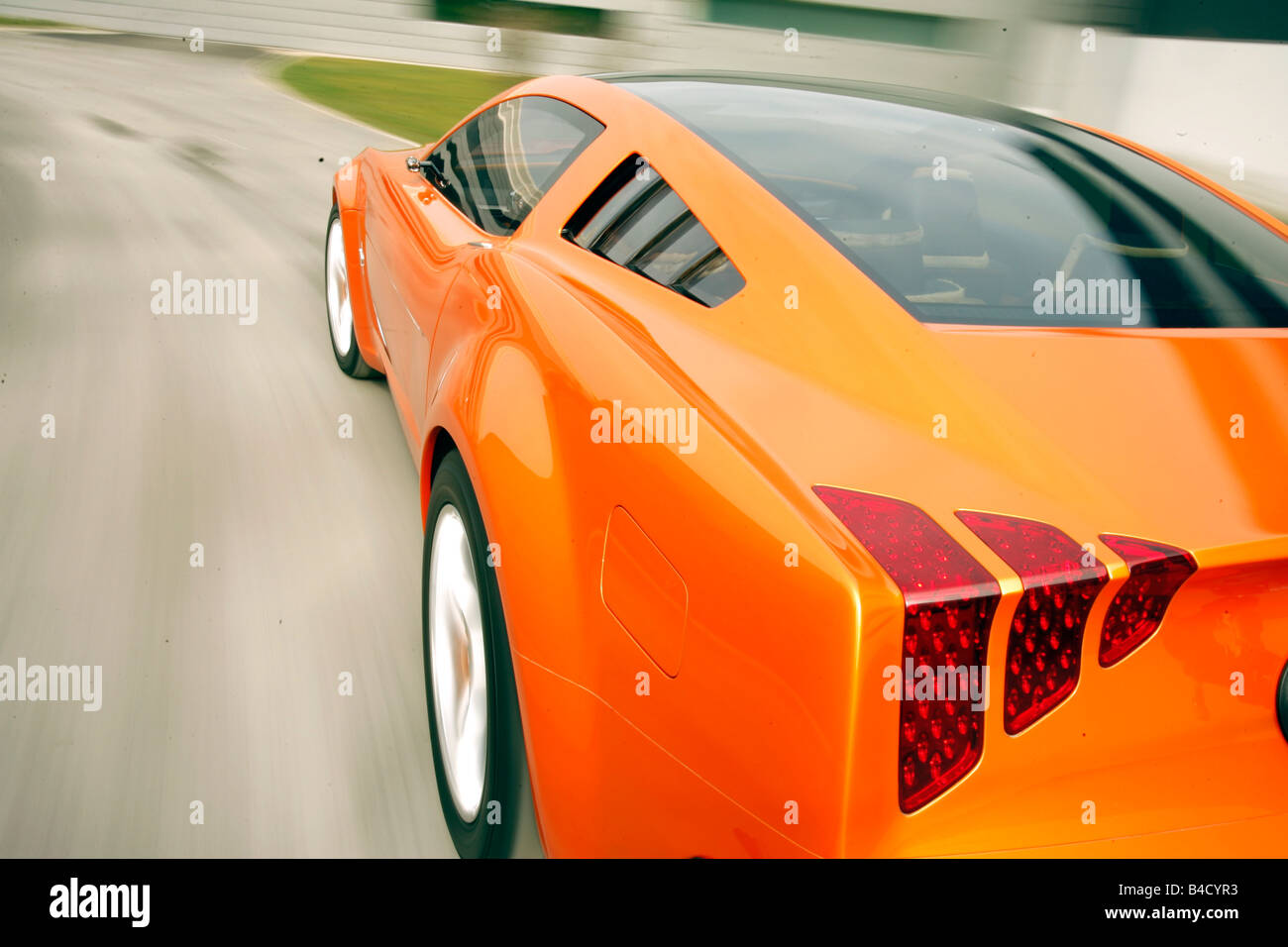 Ford Mustang by Giugiaro, model year 2007, orange -metallic, driving ...