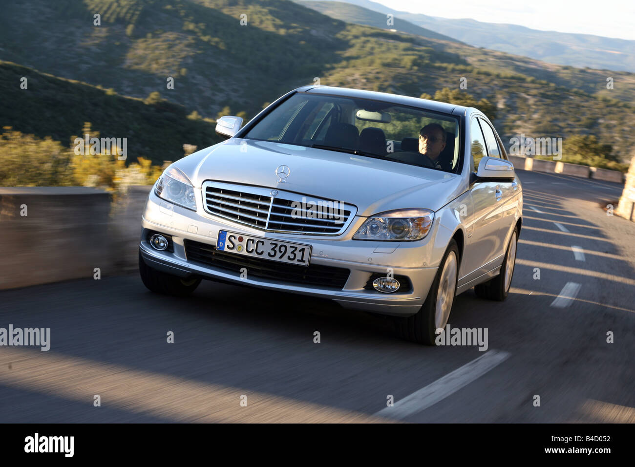 Mercedes C class, model year 2007, silver, driving, diagonal from the ...