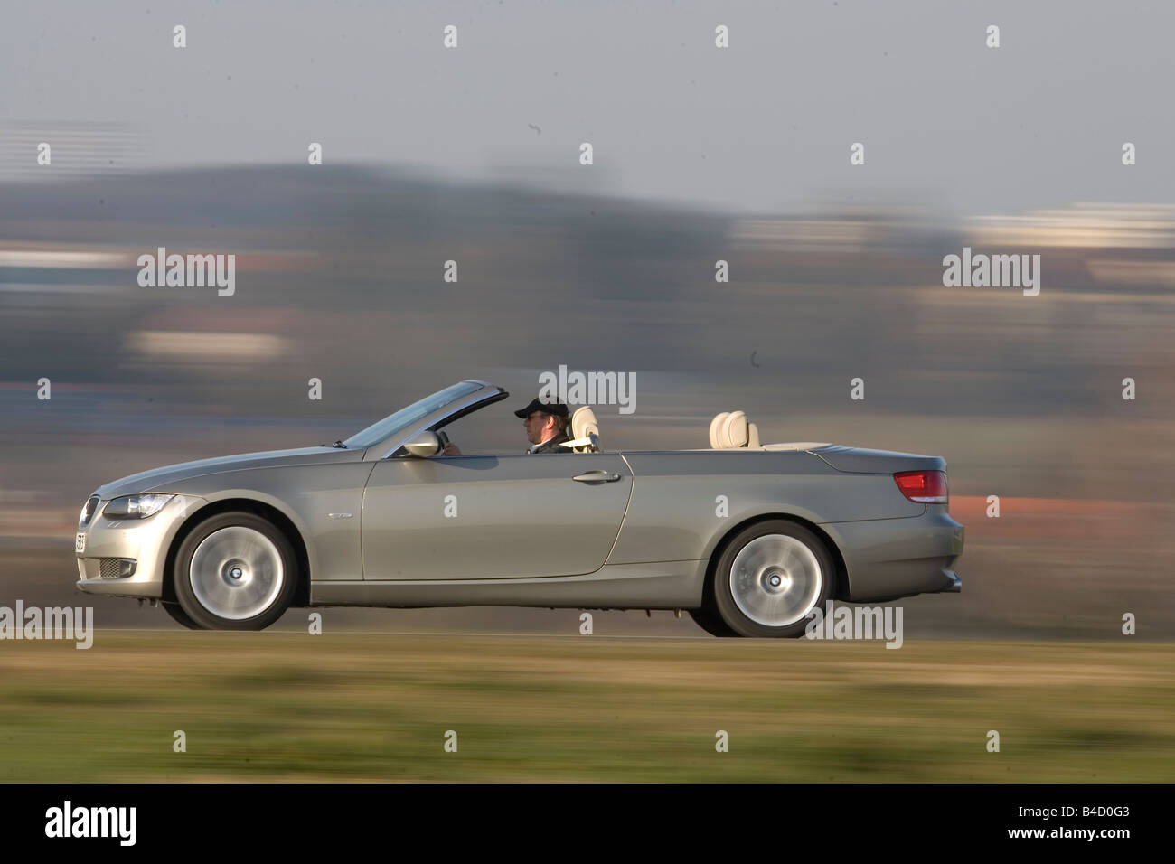 BMW 335i Convertible, model year 2007-, silver, driving, side view ...
