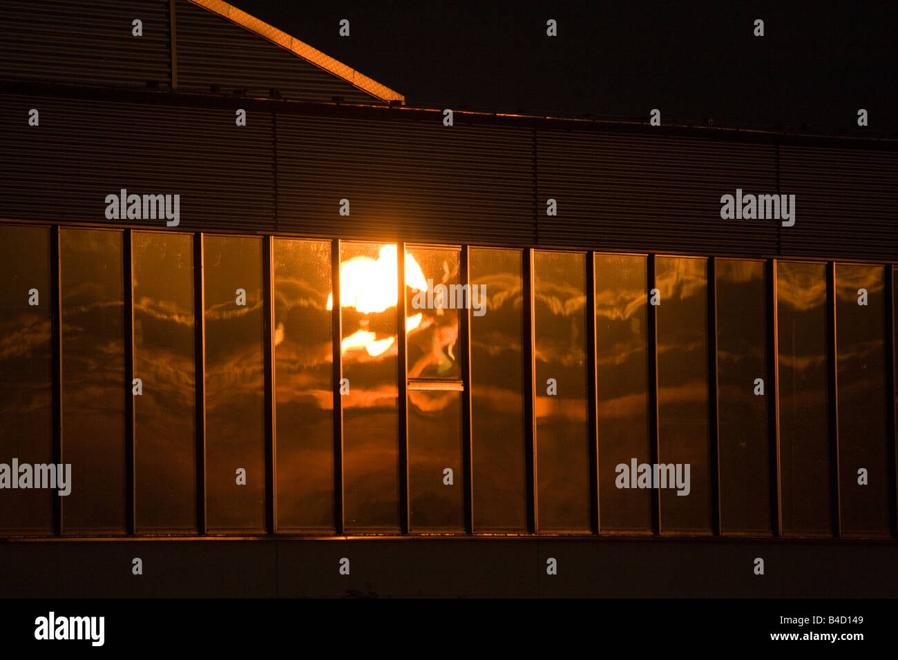 Factory on the outskirts of Kosching with the sunset reflecting in its ...