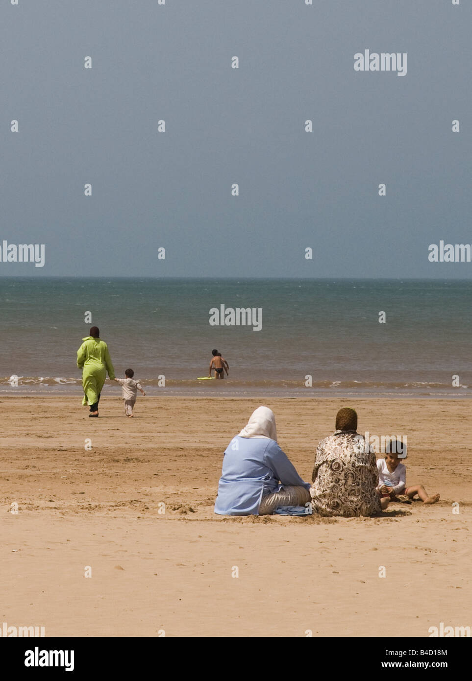 Muslim ladies on beach Stock Photo - Alamy