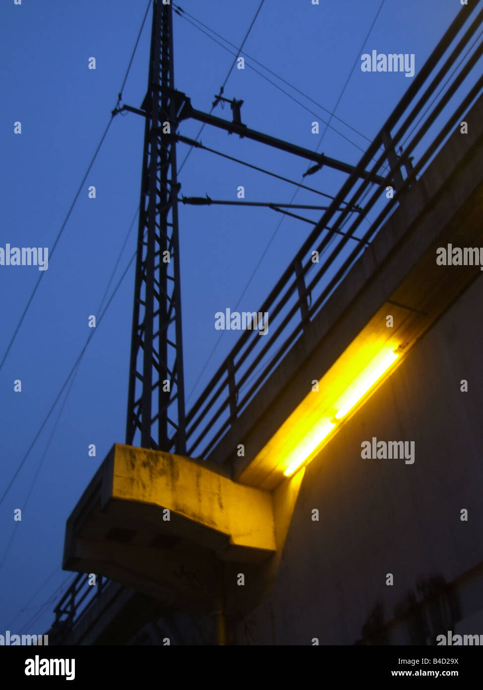detail of illuminated train bridge in city at night Stock Photo - Alamy