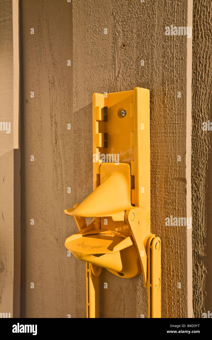 Inexpensive aluminum can crusher mounted on wall Stock Photo - Alamy