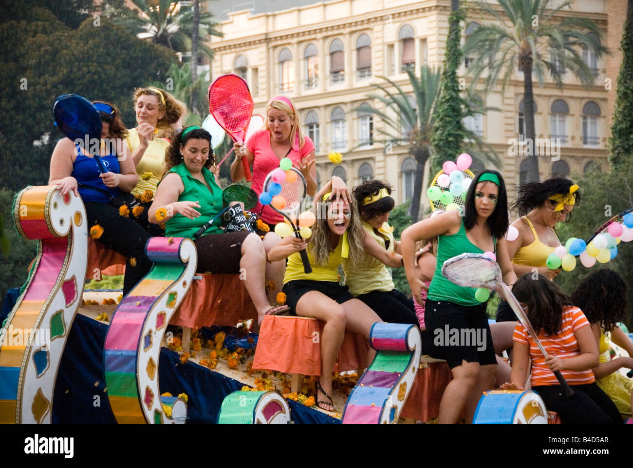 Spanish woman in costume on a float during the Battle of Flowers or ...