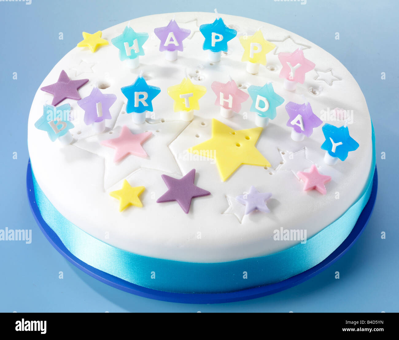 ICED HAPPY BIRTHDAY CAKE ON BLUE Stock Photo - Alamy