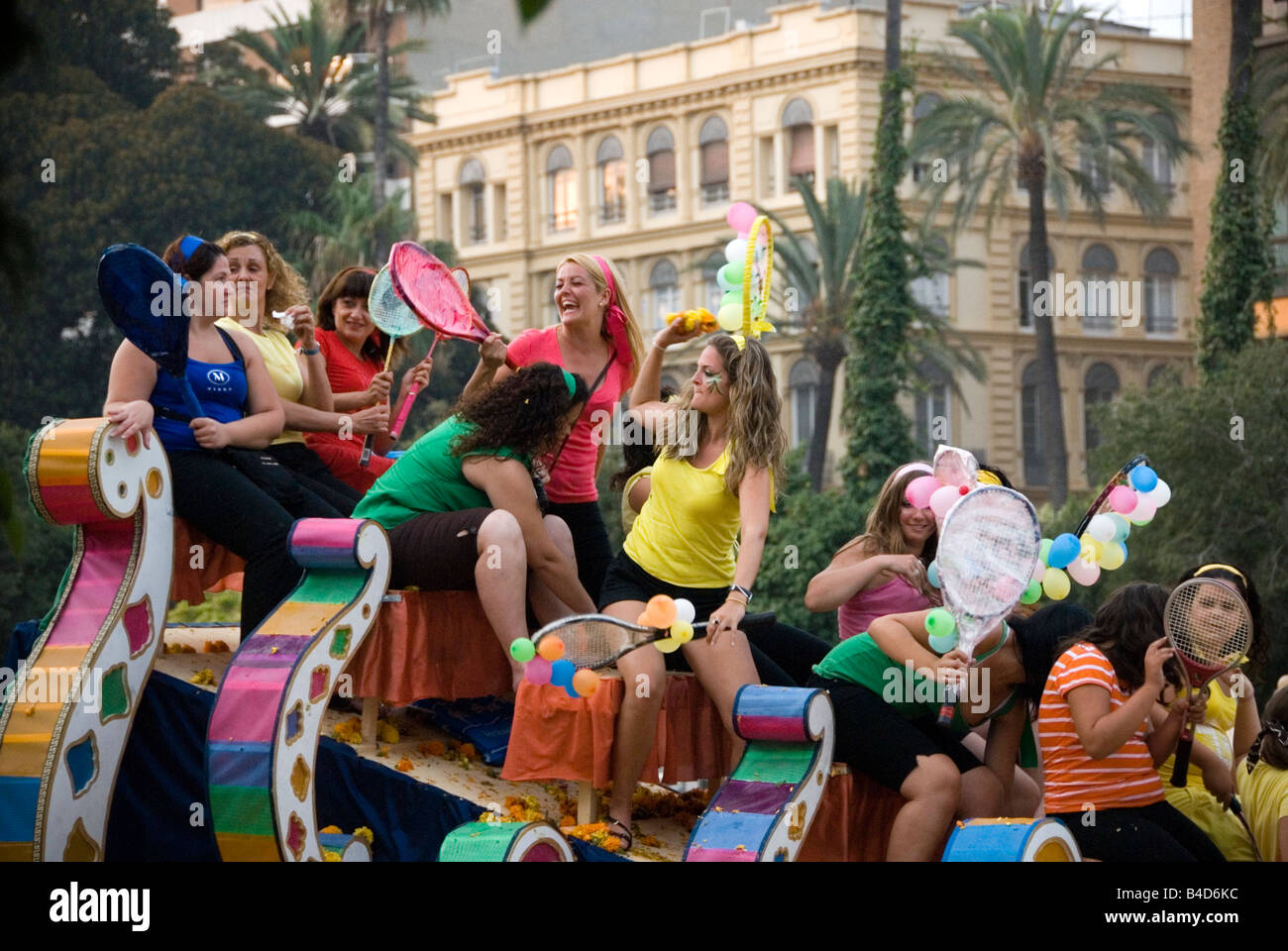 Spanish woman in costume on a float during the Battle of Flowers or ...