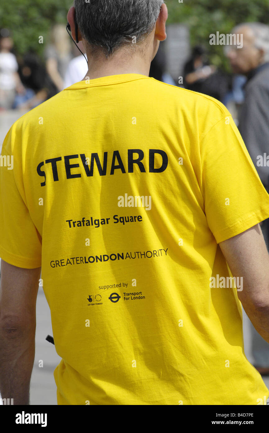 Bright yellow t shirts worn by male steward at the Liberty Festival ...