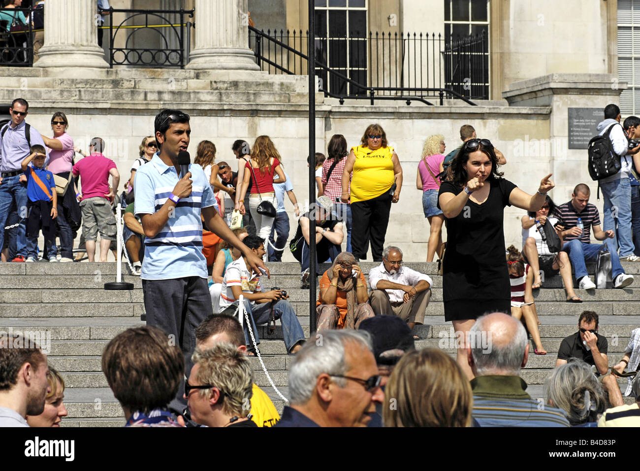 A deaf woman signing along side a show announcer at the Liberty ...