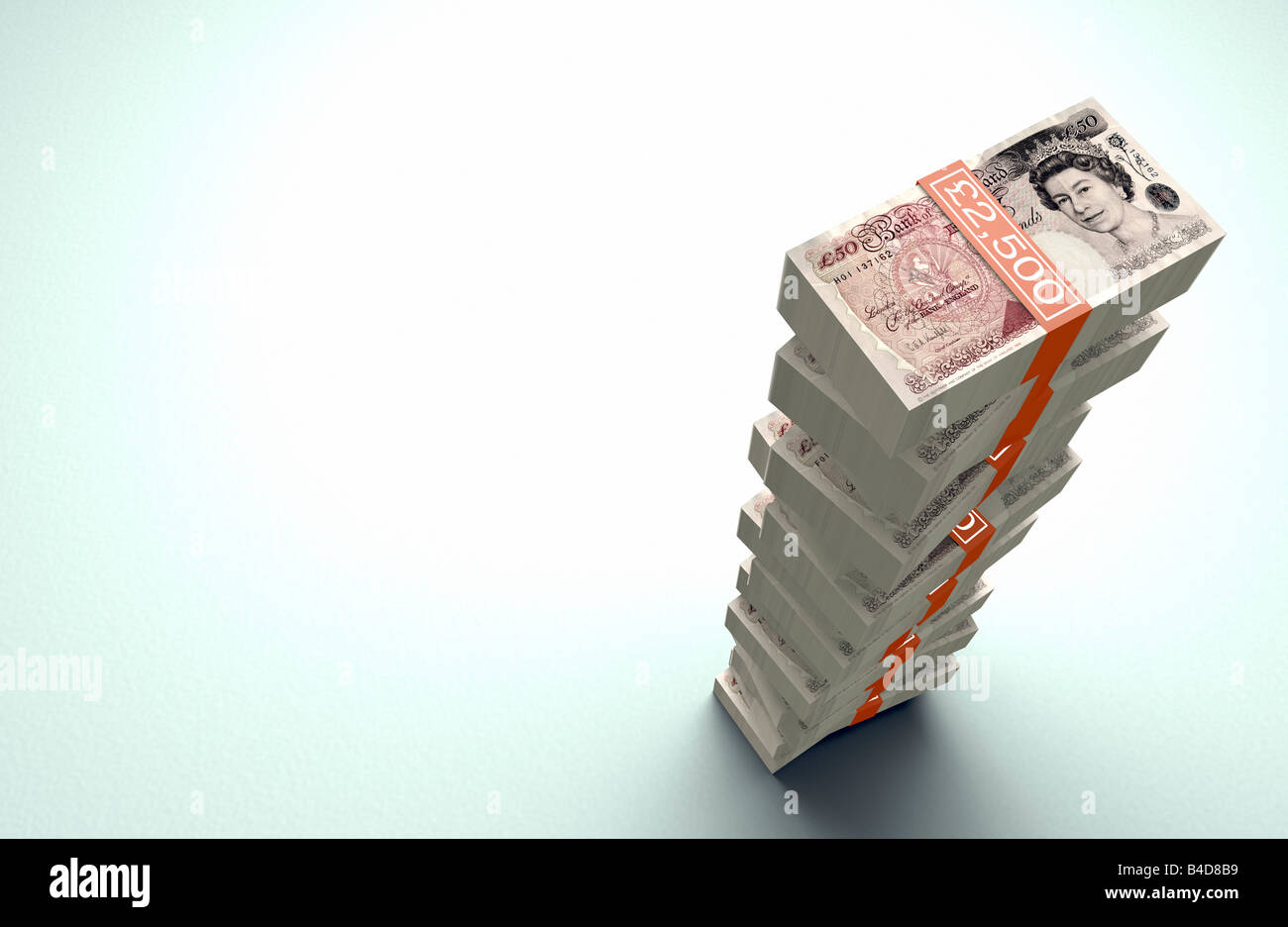 Large stack of £50 pound British bank notes on plain background with ...