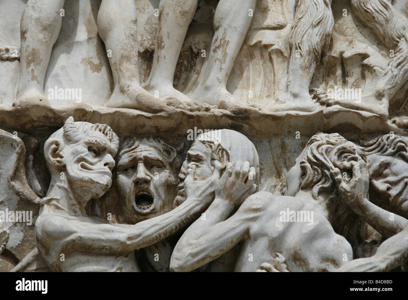 sculpture of hell on orvieto cathedral facade, italy Stock Photo - Alamy