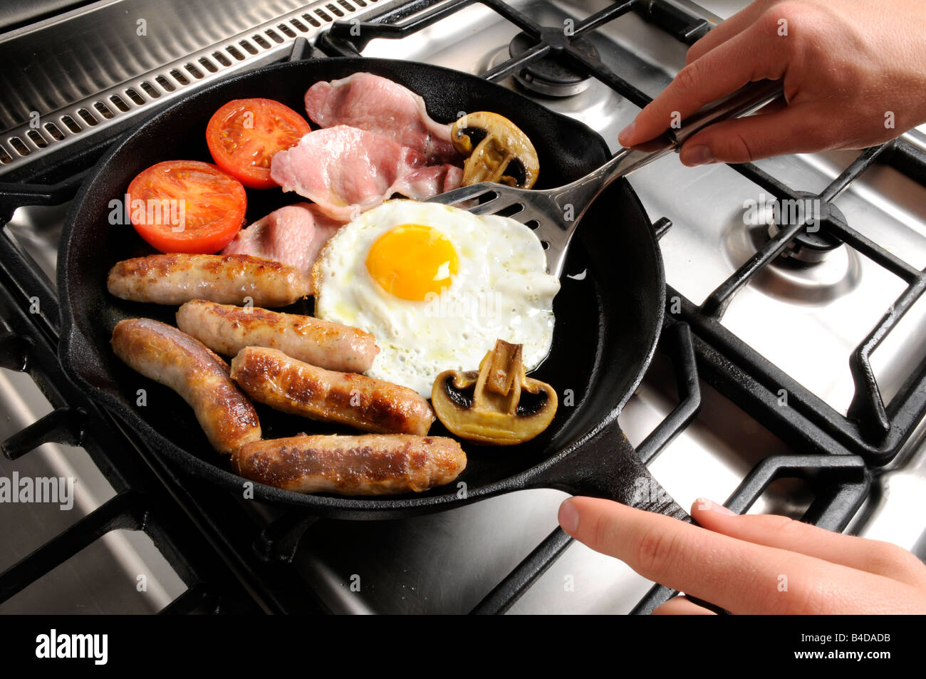 MAN COOKING FRIED BREAKFAST Stock Photo - Alamy