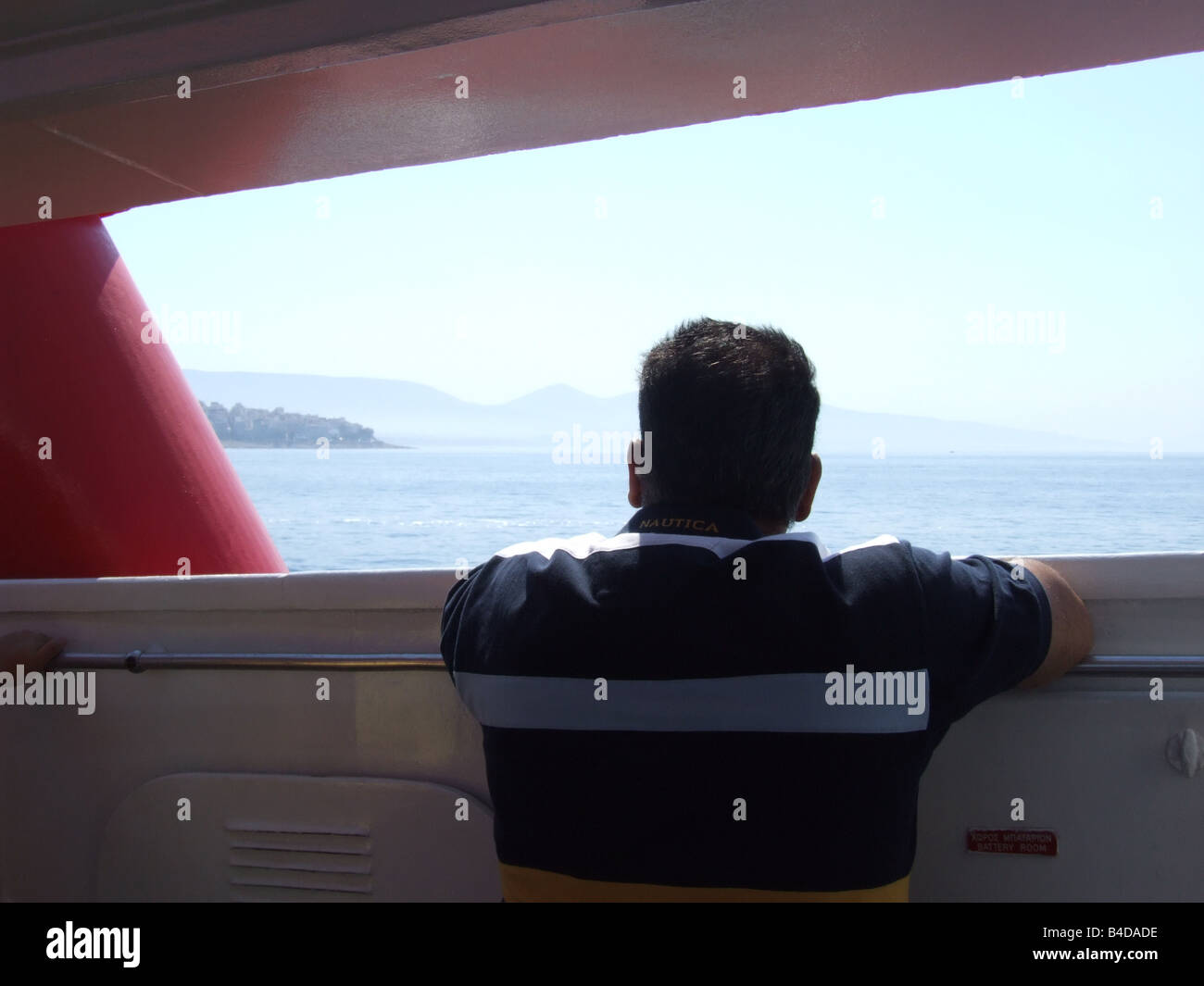 ferry passenger looking out to sea in greece Stock Photo - Alamy