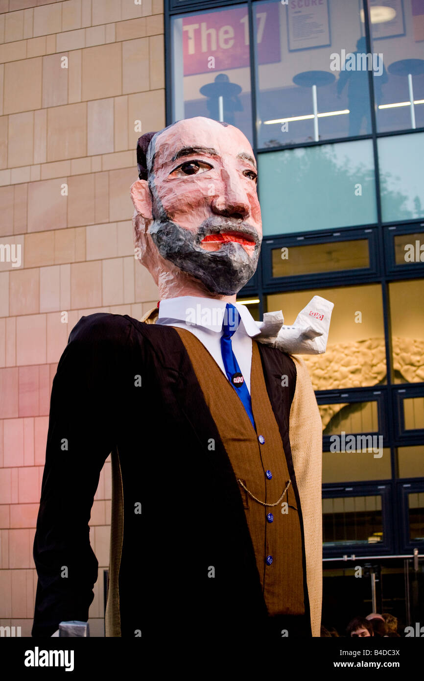 Large Papier-mache puppet and crowds in Derby City market place during ...