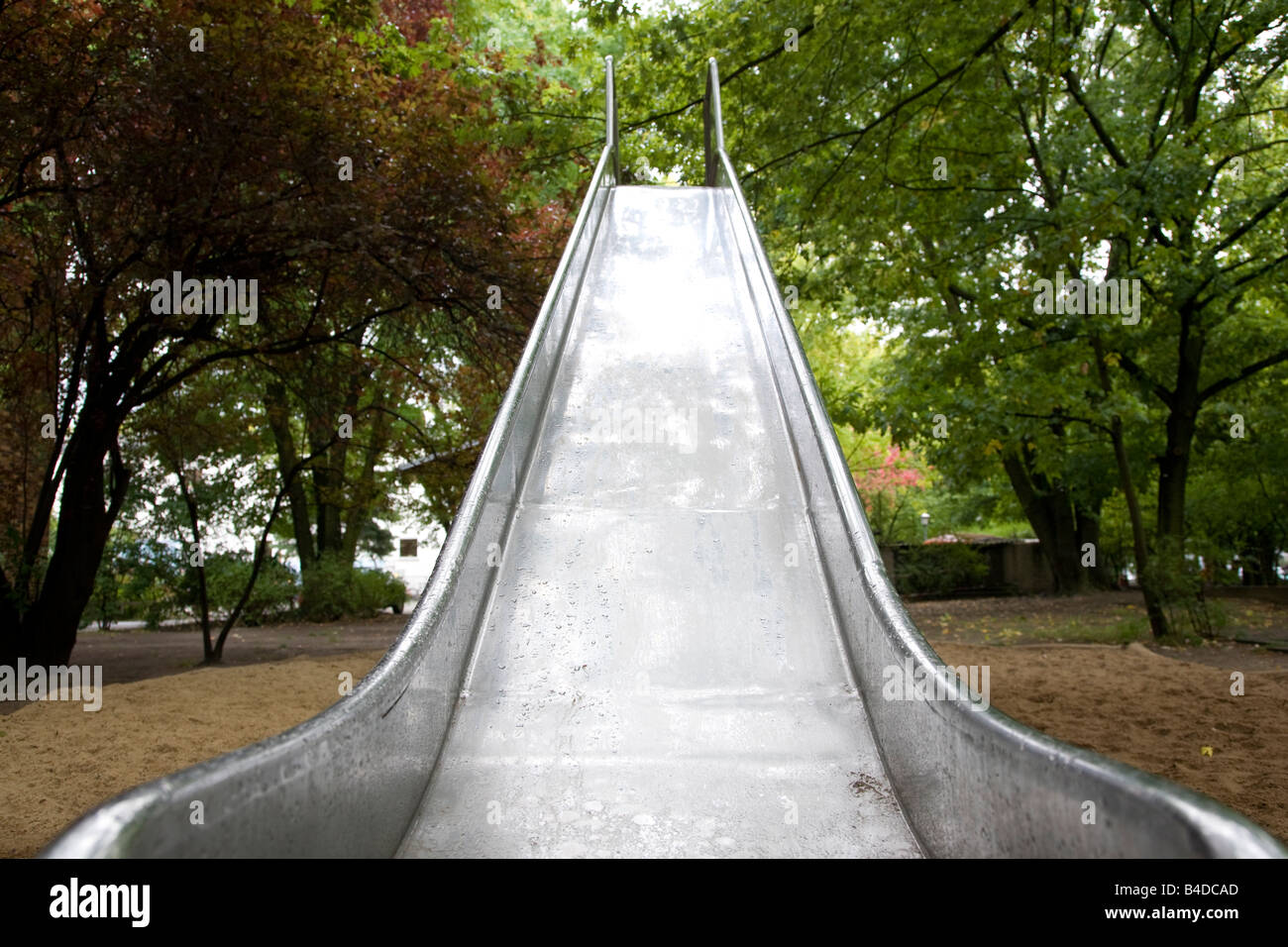 Playground childrens steel slide hi-res stock photography and images ...