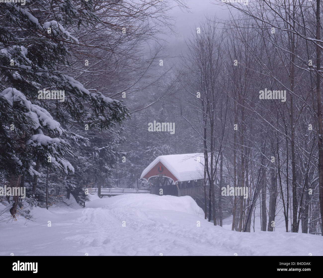 Covered Bridge during Snow Storm Stock Photo - Alamy