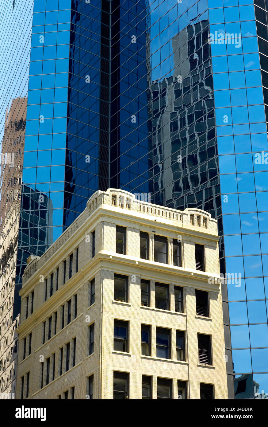 Old building in front of new building in New York City USA Stock Photo ...