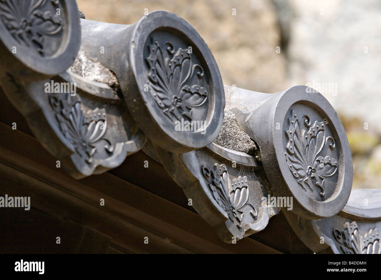 Detail of circular family crest tiles of lords at Himeji Castle Stock ...