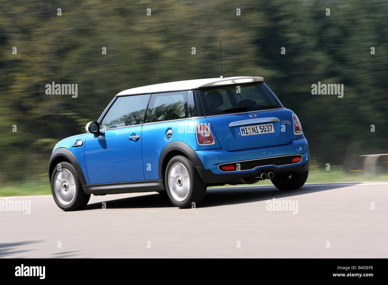 Mini Cooper S, model year 2006-, blue moving, diagonal from the back ...