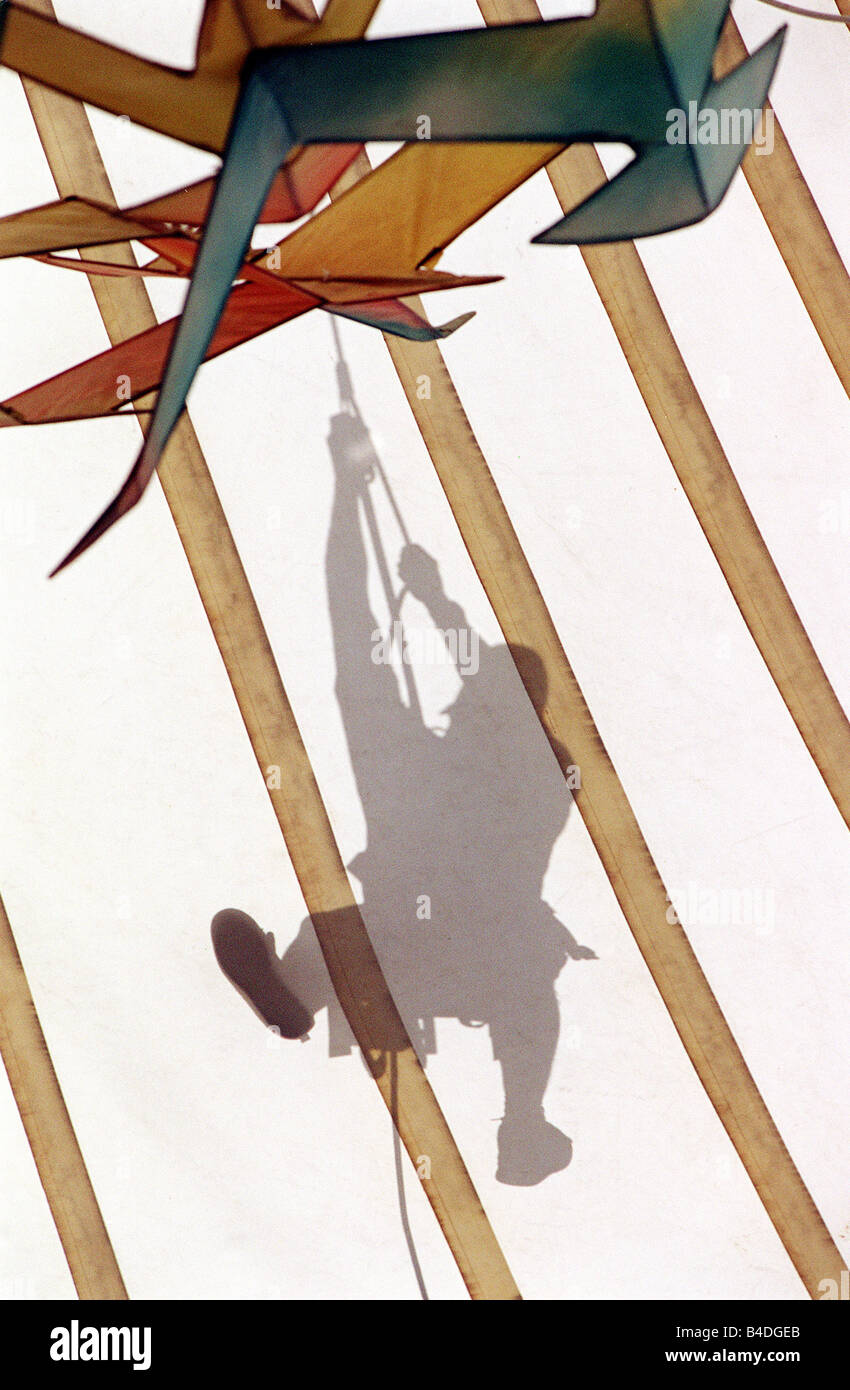 A worker climbs the outside of a circus tent Stock Photo - Alamy
