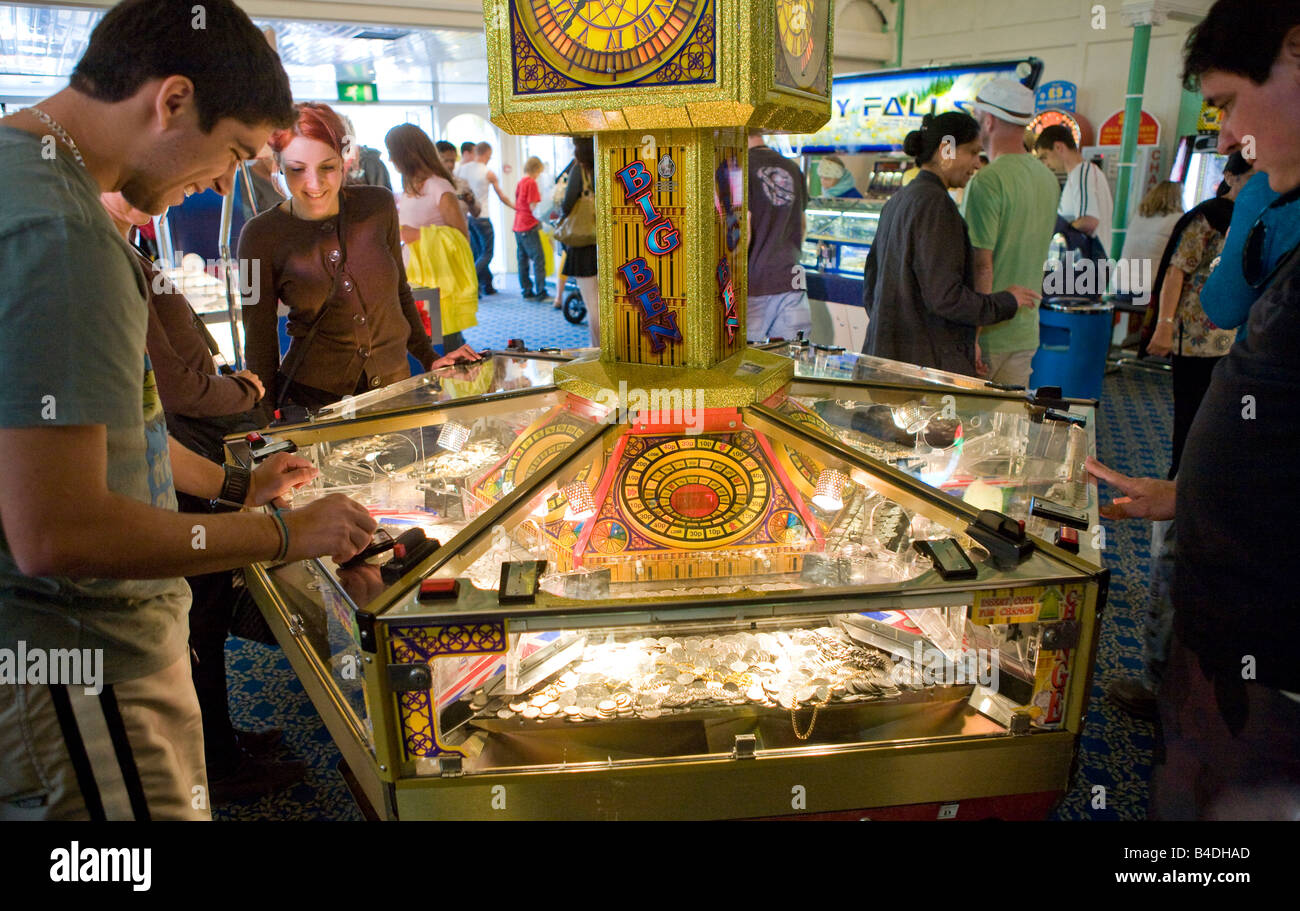 People Playing In The Penny Arcade On Brighton Pier Sussex UK Europe ...